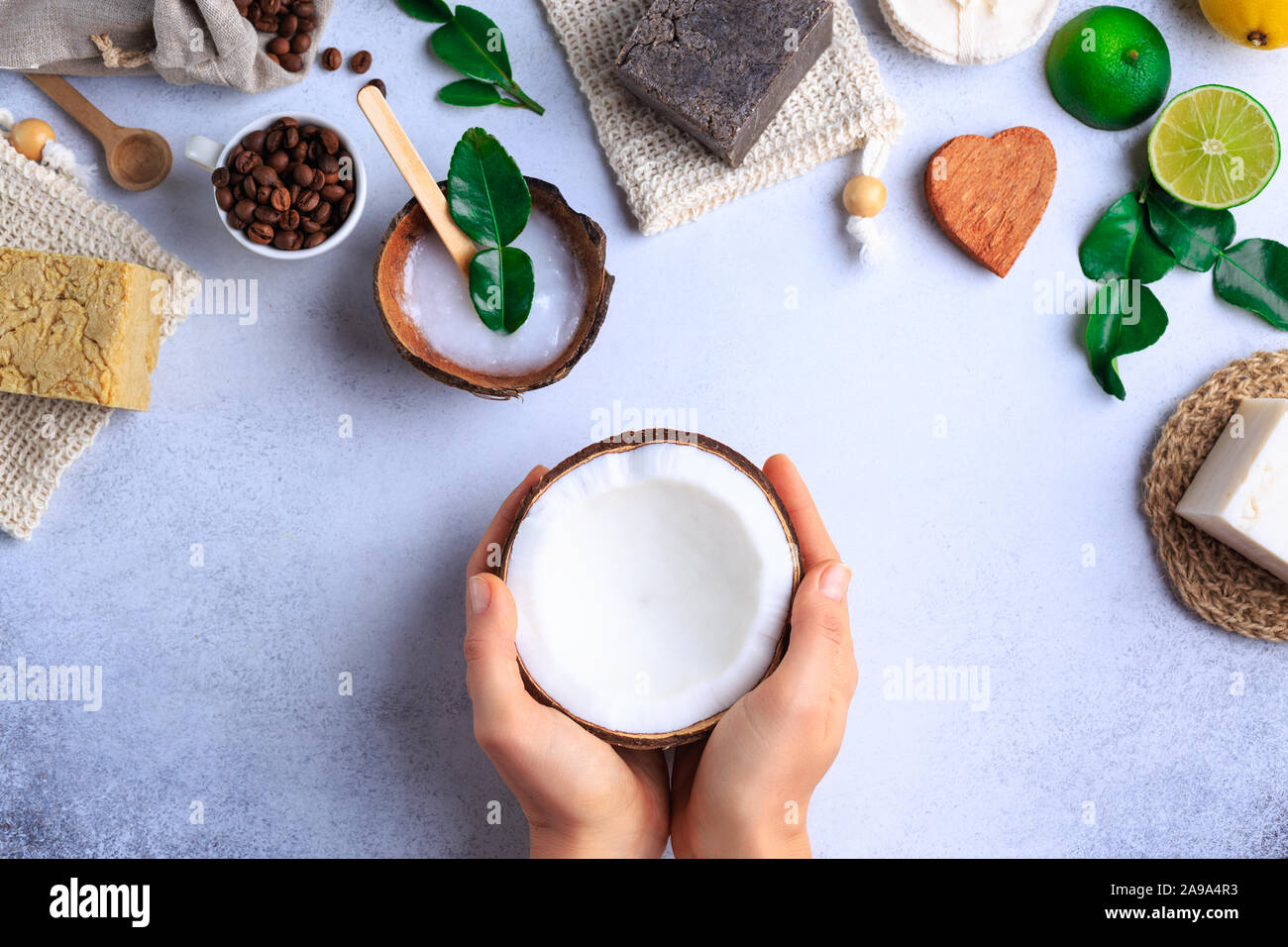 Natural cosmetic products setting with soaps and fresh herbs top view ...