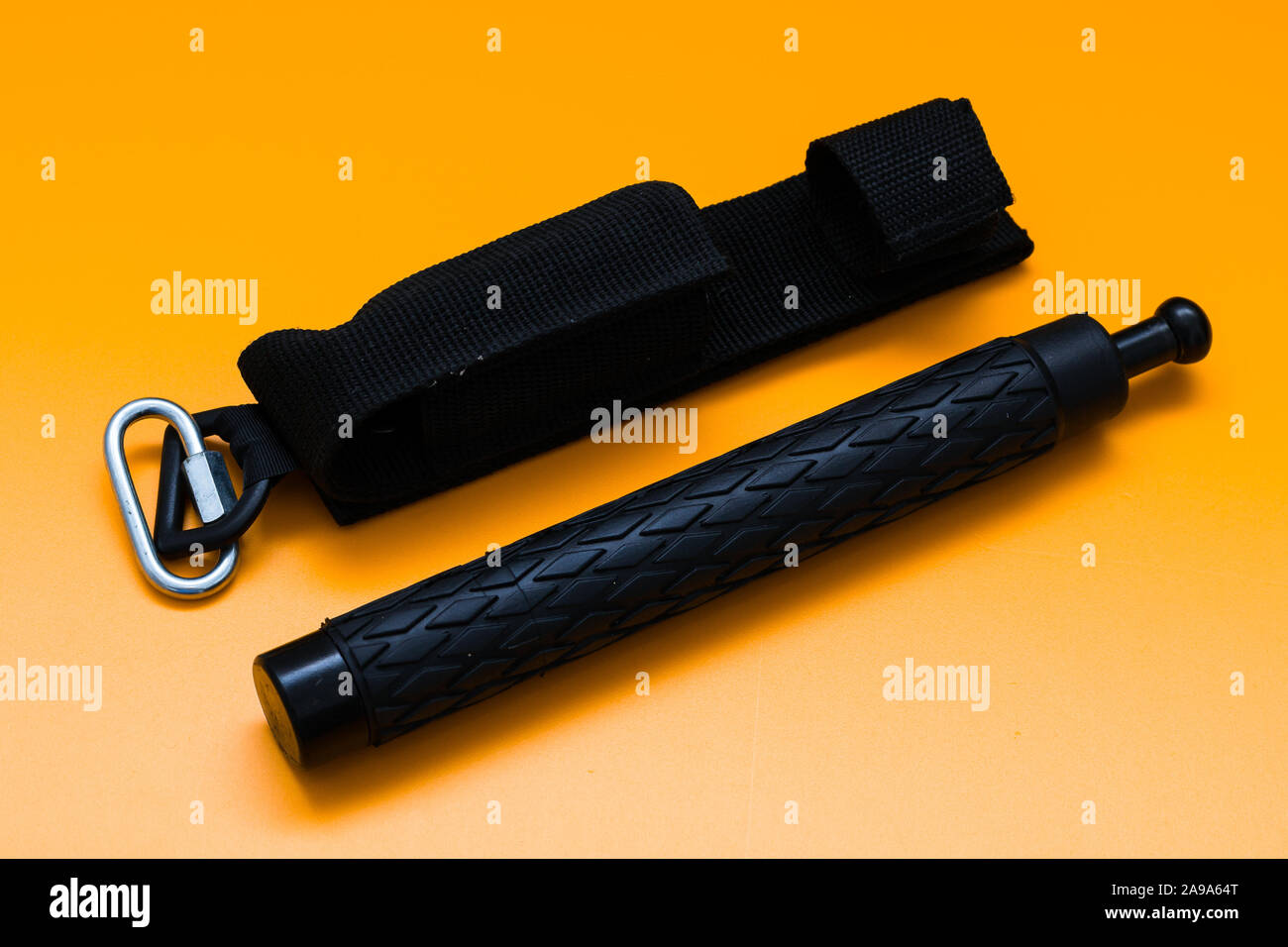 Black telescopic expandable baton / truncheon isolated Stock Photo - Alamy