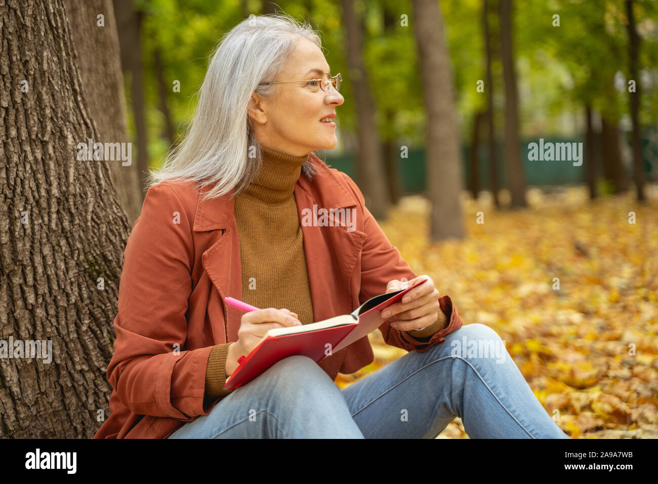 Mature pretty woman looking into the distance Stock Photo - Alamy