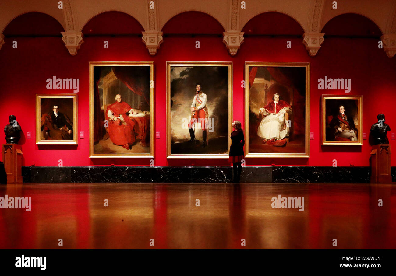 Royal collection staff member amongst the waterloo chamber portraits hi ...