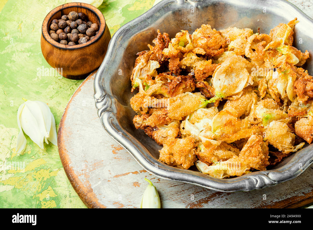 Fried yucca flowers.An unusual dish of edible flowers Stock Photo - Alamy