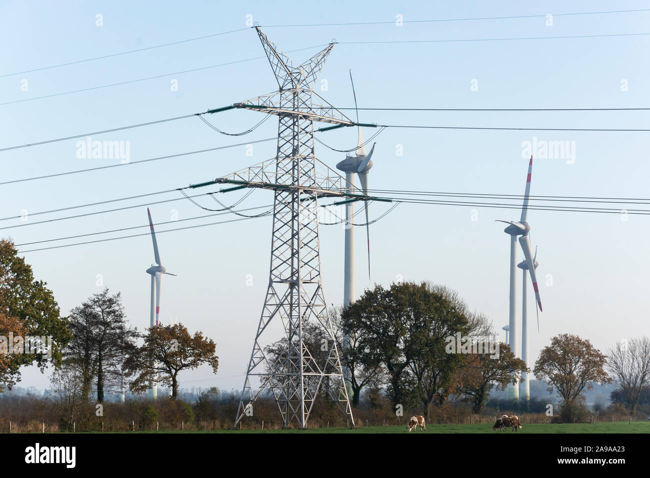 Pylons and wind turbine Stock Photo - Alamy