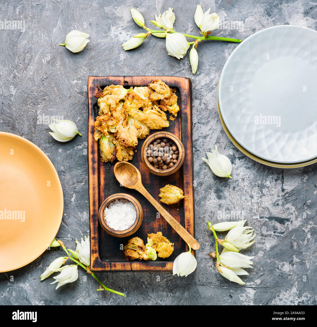Fried yucca flowers.An unusual dish of edible flowers Stock Photo - Alamy