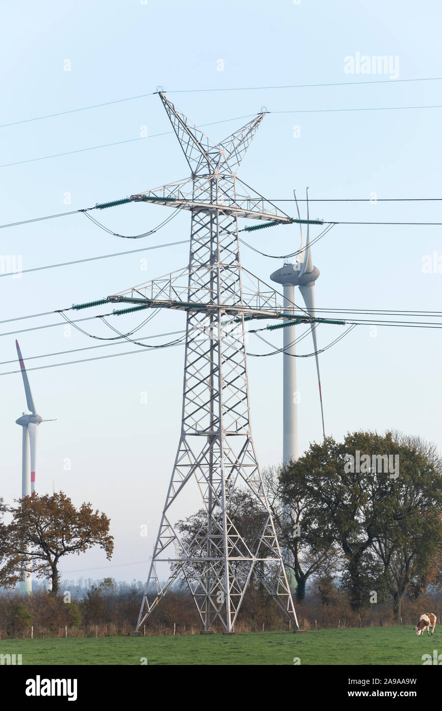 Pylons and wind turbine Stock Photo - Alamy