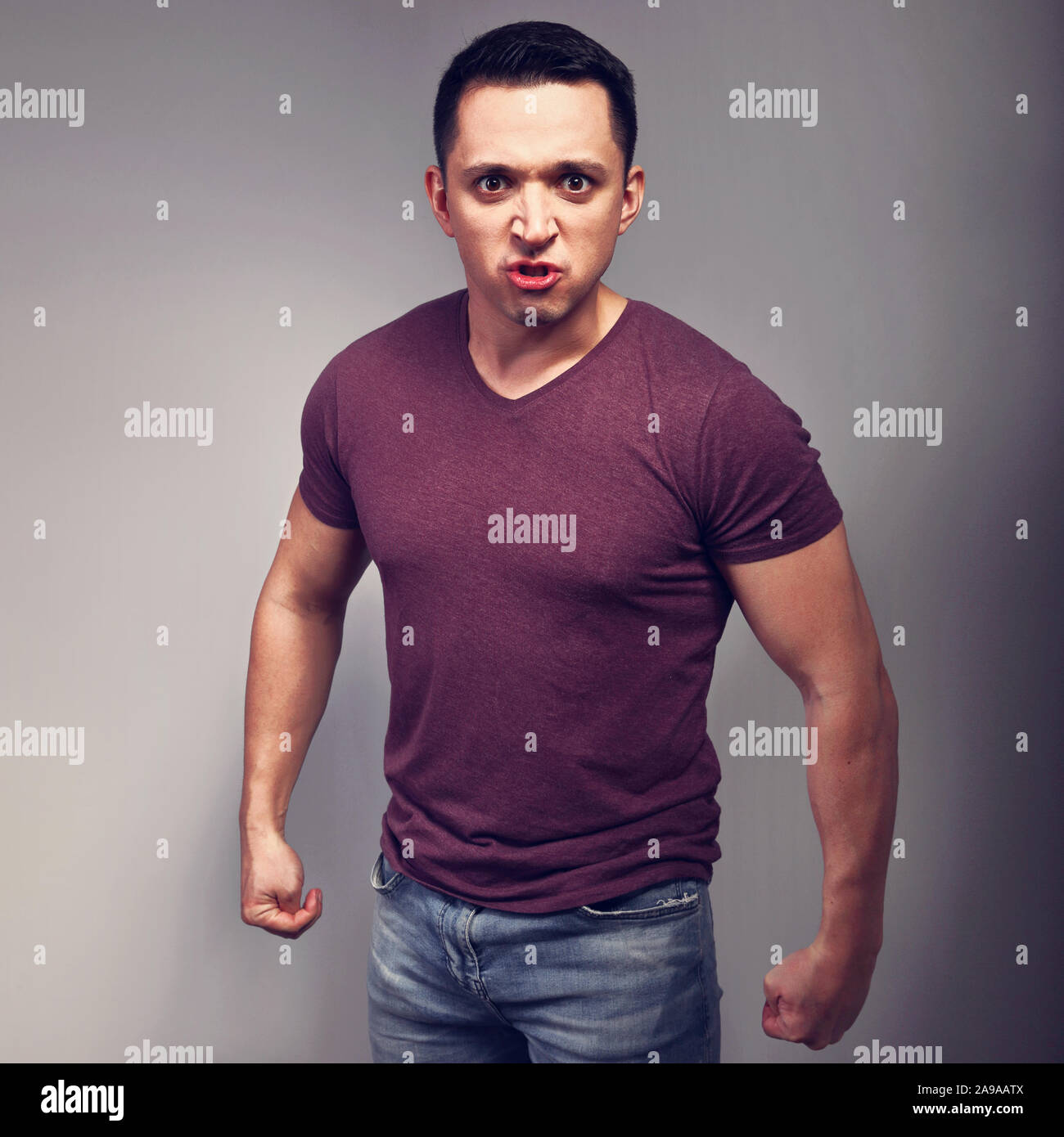 Angry man in casual t-shirt and blue jeans with negative emotion ...