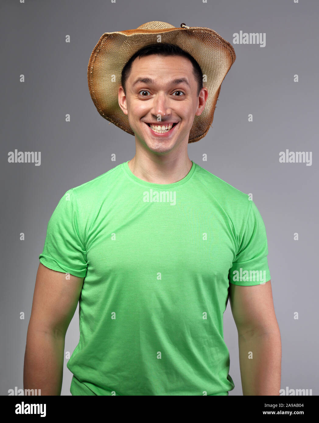 Fun crazy man showing facial grimace in summer hat with fun toothy ...