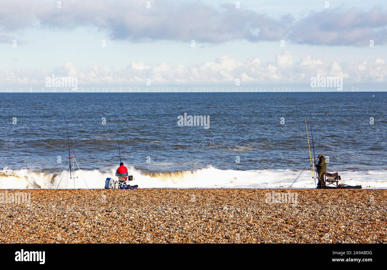 Two sea anglers fishing from the shore in North Norfolk at Cley-next ...
