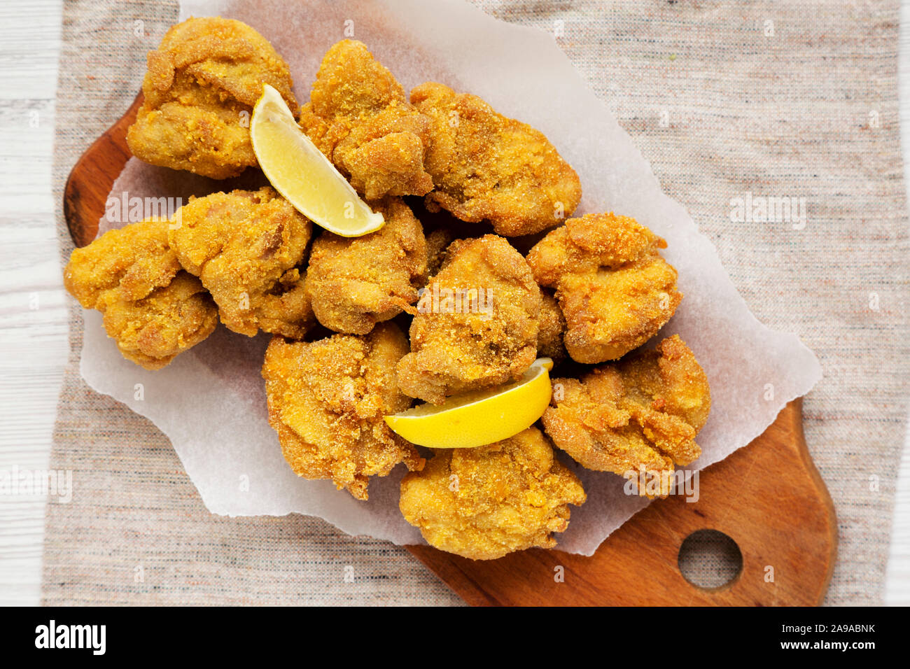 Homemade traditional japanese fried chicken Karaage on a rustic wooden ...