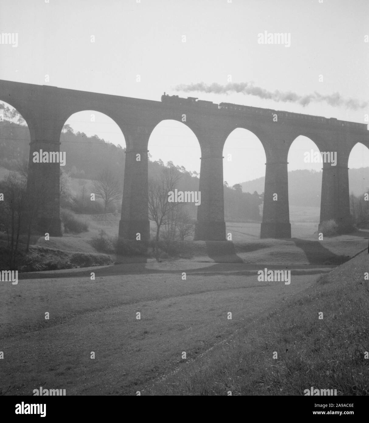 A railway train of the Deutsche Reichsbahn transport company on its way ...