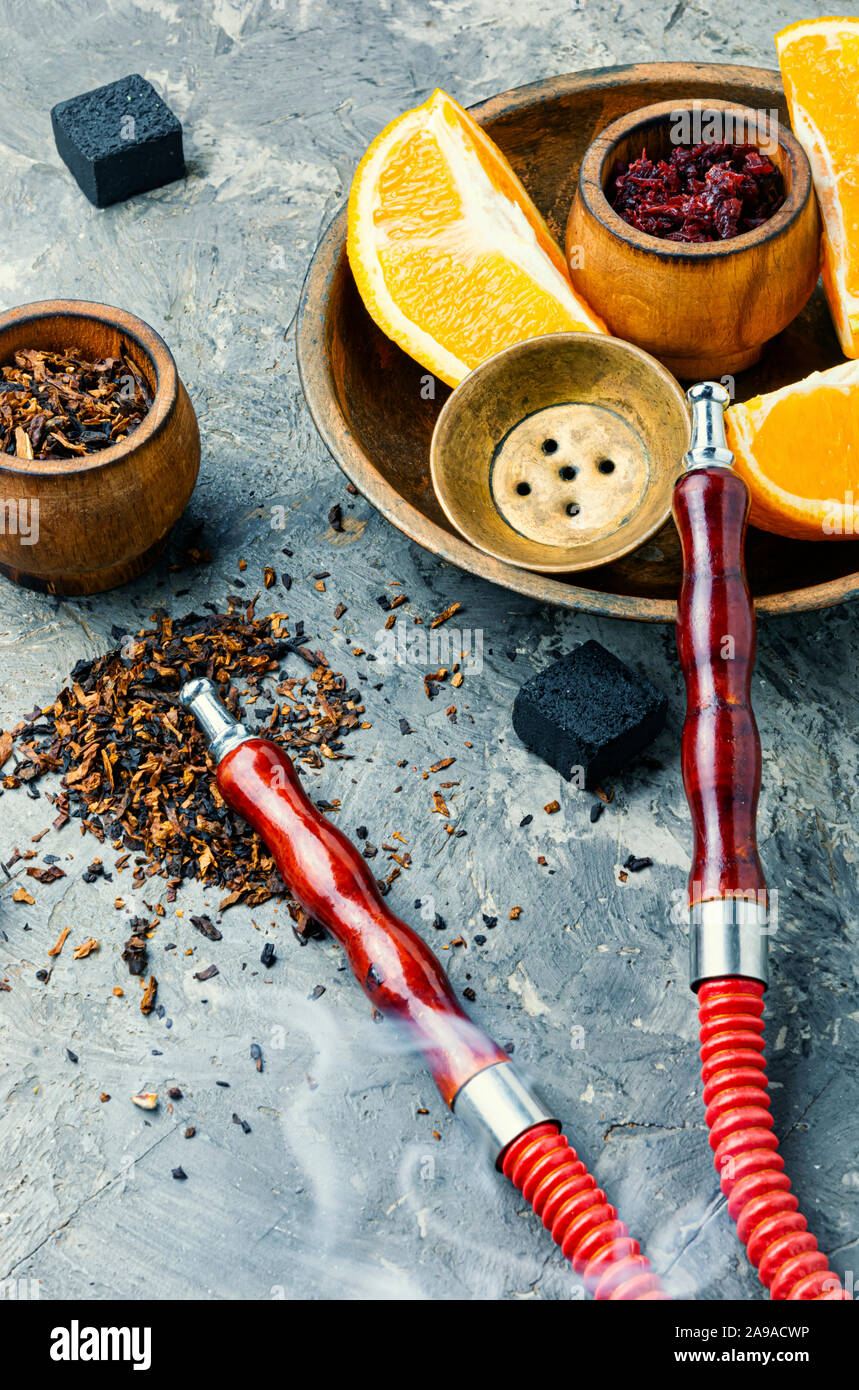 Smoking turkish shisha with orange.Details of Oriental hookah.Egyptian ...