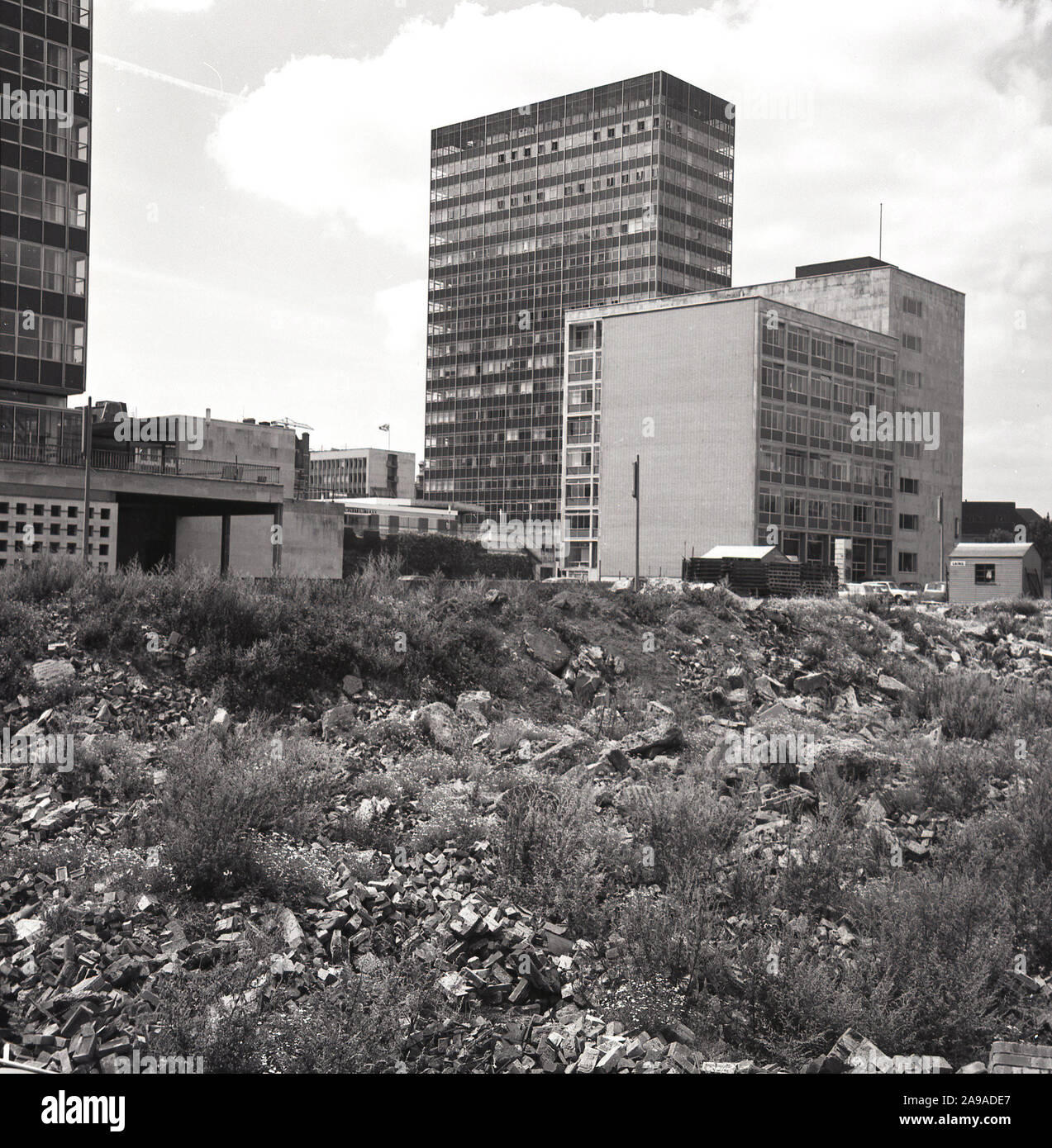 1960s, historical, new modern office tower blocks next to a WW2 bomb ...