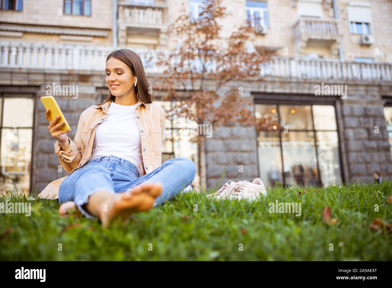 Beautiful woman choosing a song to listen Stock Photo - Alamy
