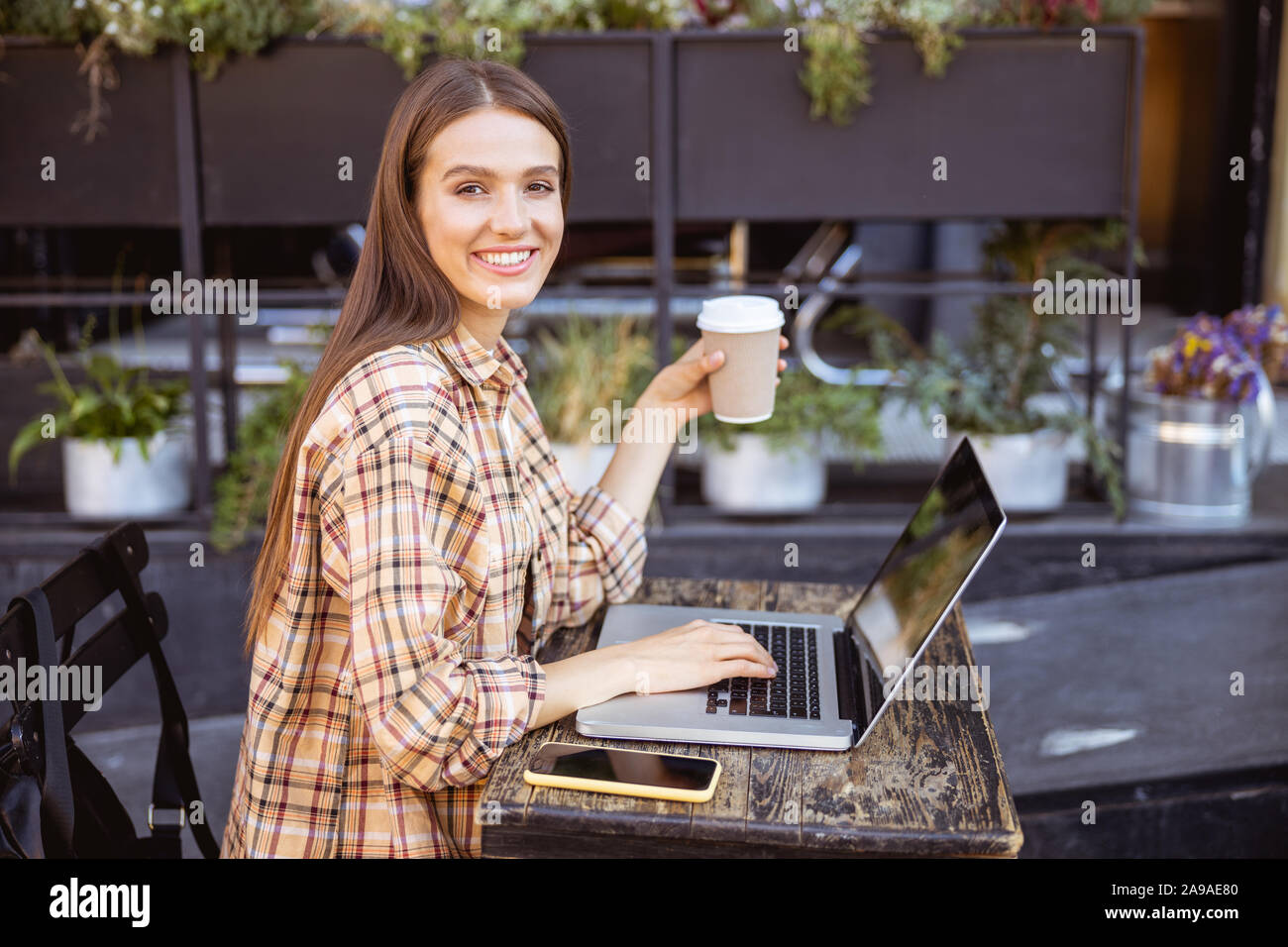 Beautiful lady beginning her morning in the cafe Stock Photo - Alamy