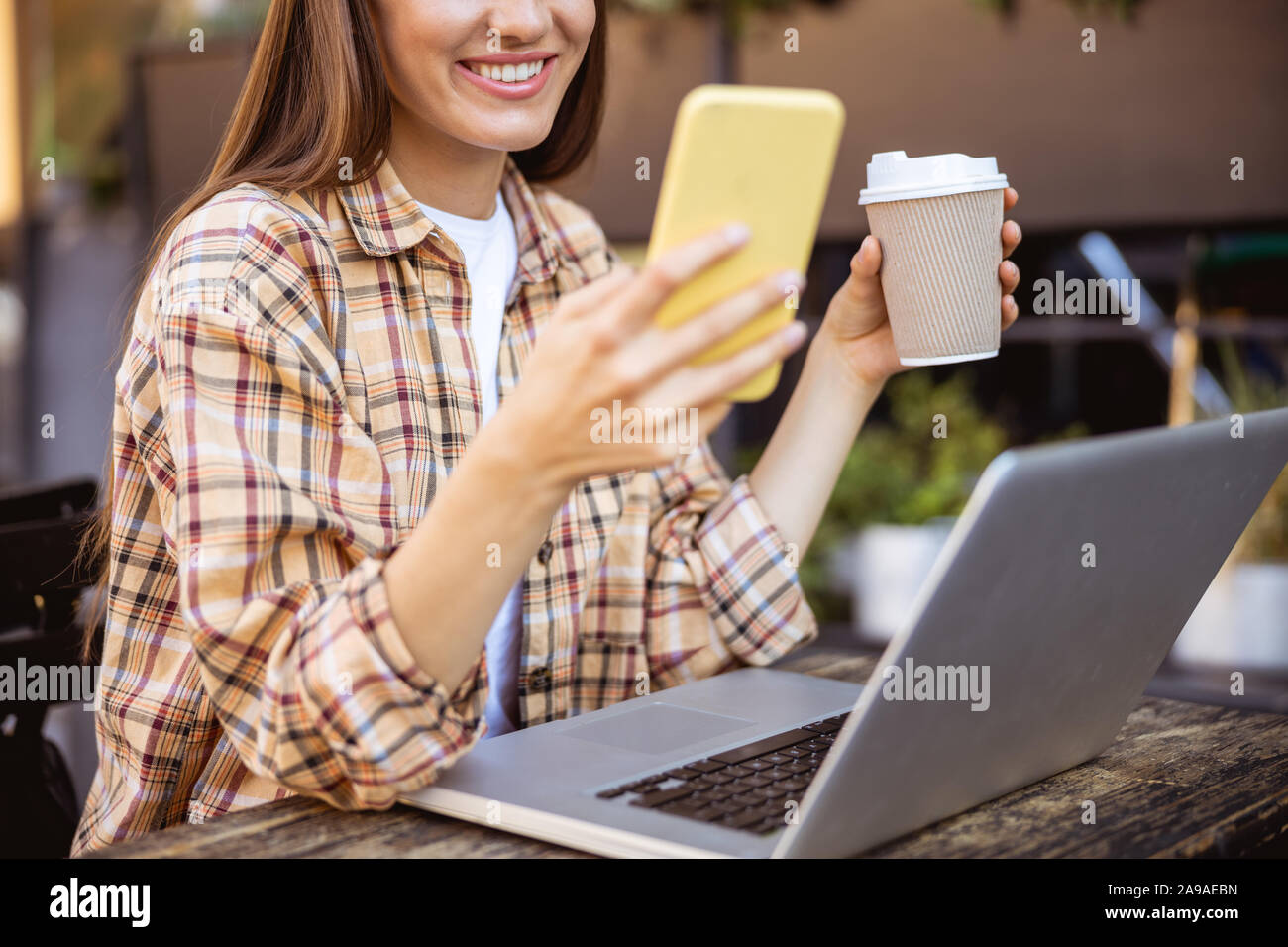 Pretty lady reading her incoming phone messages Stock Photo - Alamy