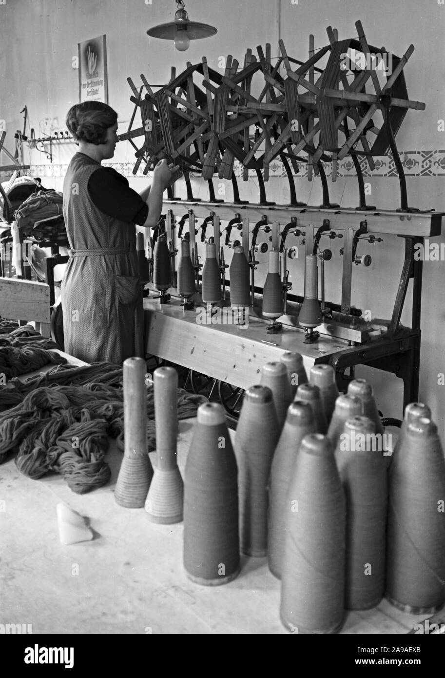Worker at a weaving and spinning factory, Germany 1930s Stock Photo - Alamy