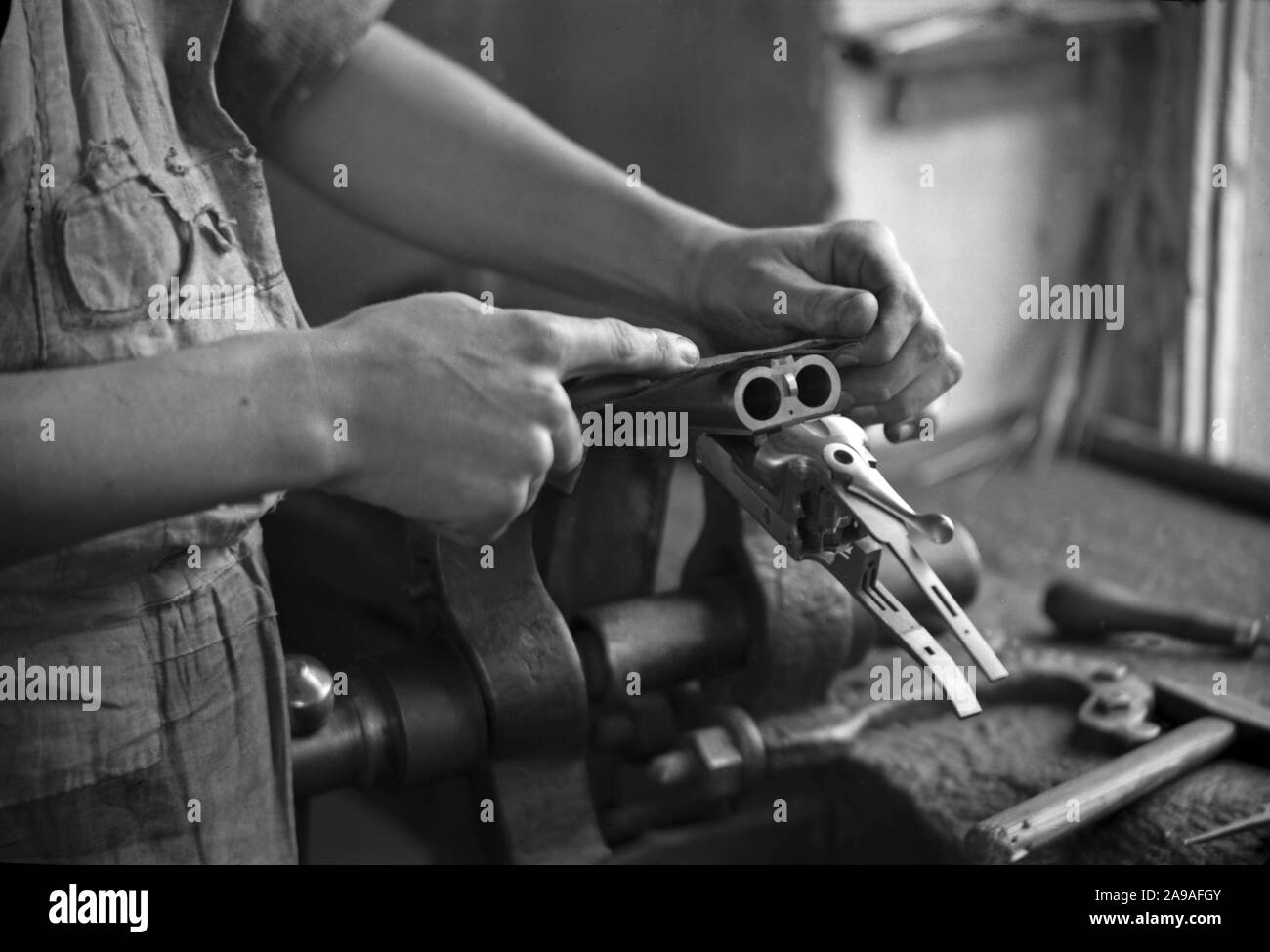 The work of a gunsmith at Karlsbad, 1930s Stock Photo - Alamy