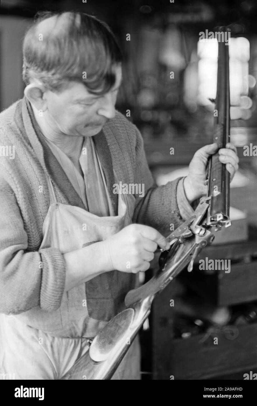 The work of a gunsmith at Karlsbad, 1930s Stock Photo - Alamy