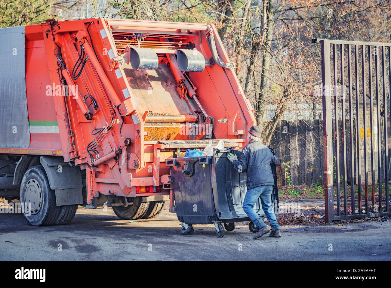 Process of garbage loading to the garbage truck Stock Photo - Alamy
