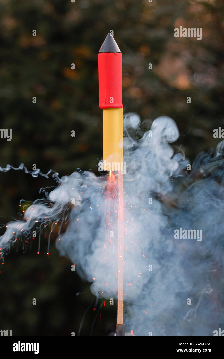 Launching rocket with fire and plenty of smoke Stock Photo - Alamy