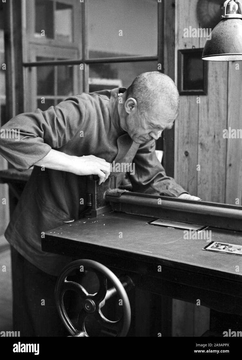 Professions at a printing office. Here the photoengraver, Germany 1930s ...