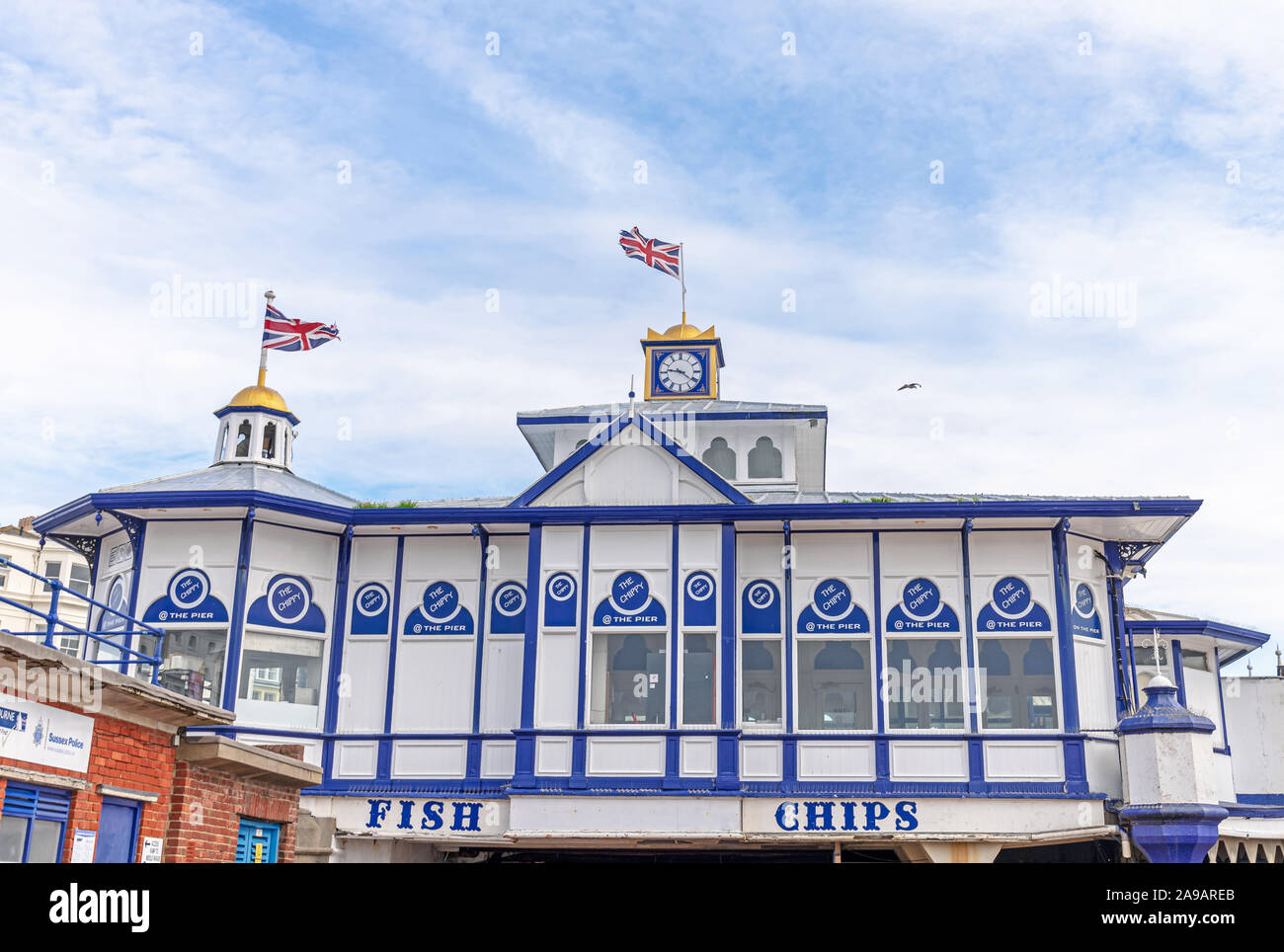 Typical seaside fish and chip restaurant at the end of a pier. Decorated in blue and white ...