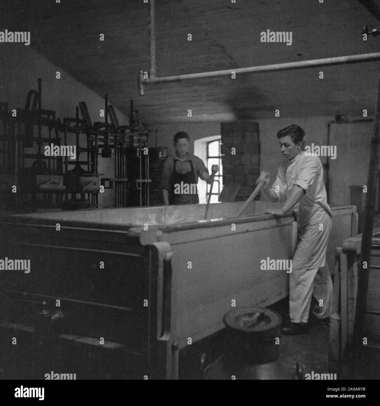 Two workers of a paper mill producing paper, Germany 1930s Stock Photo ...