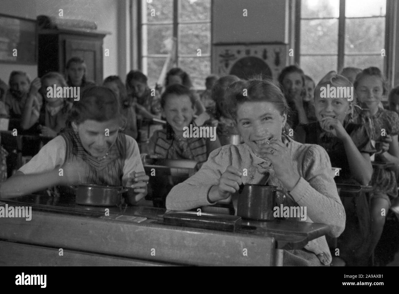 Children get the school lunch, Germany 1940s Stock Photo - Alamy
