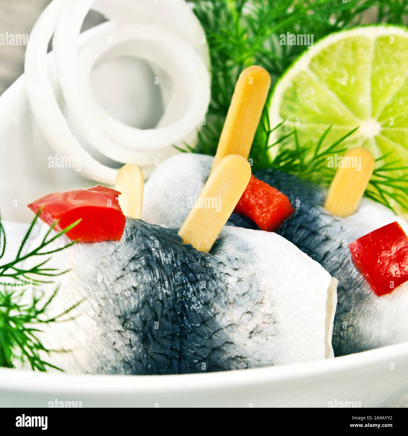 Pickled marinated herring rolls Stock Photo - Alamy