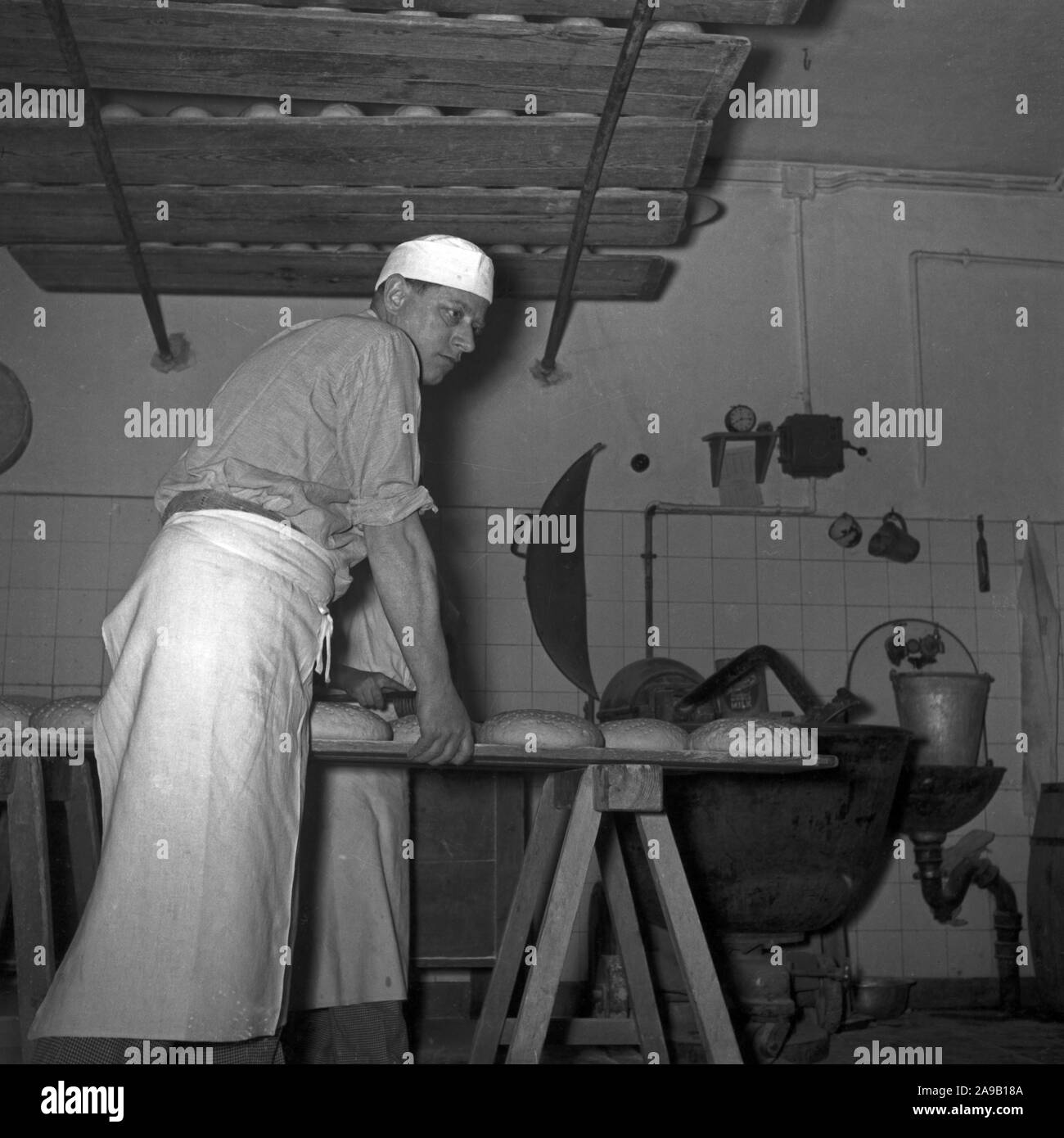 A bakerman and his daily business, Germany 1950s Stock Photo - Alamy