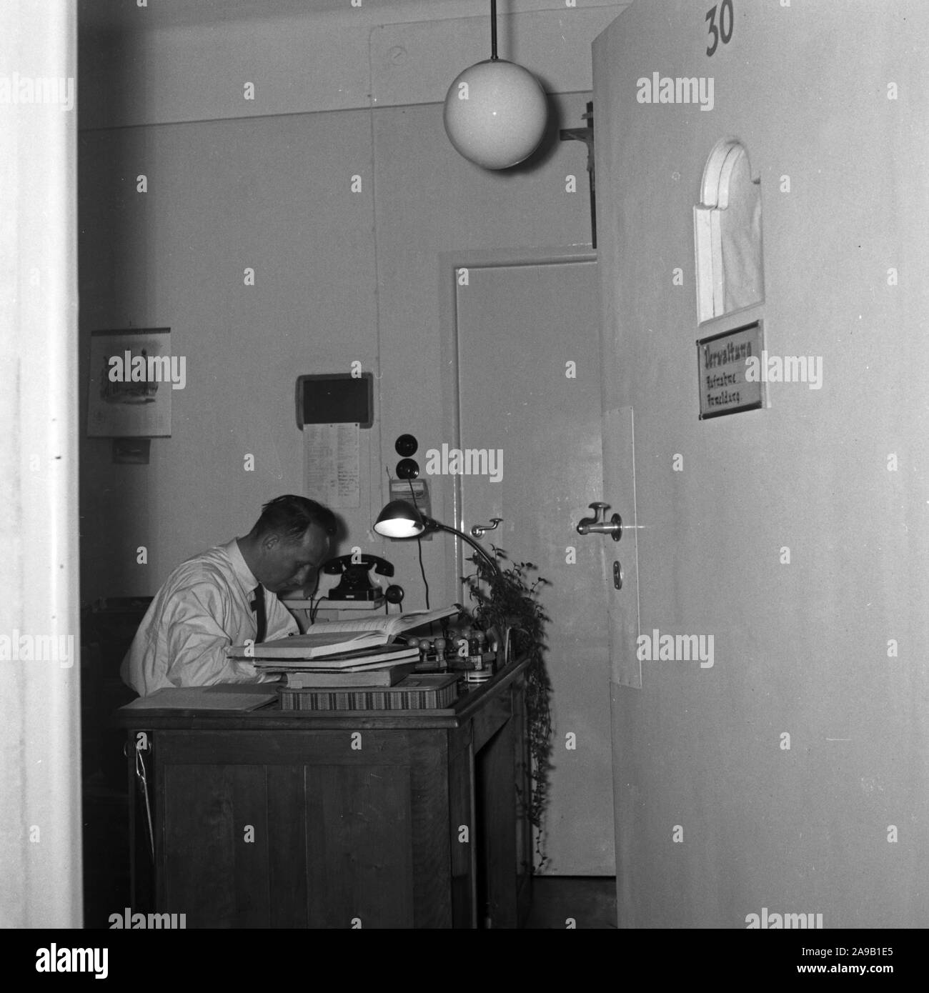 A hospital, run by nuns, here: a doctor at his office, Germany 1950s ...