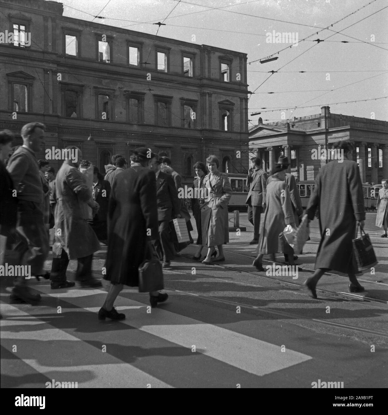 Passers by crossing a street at the city of Stuttgart, Germany 1950s ...