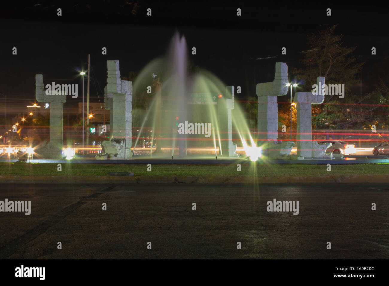 Night traffic around the fountain. Mayan demigod Kukulkan is a ...