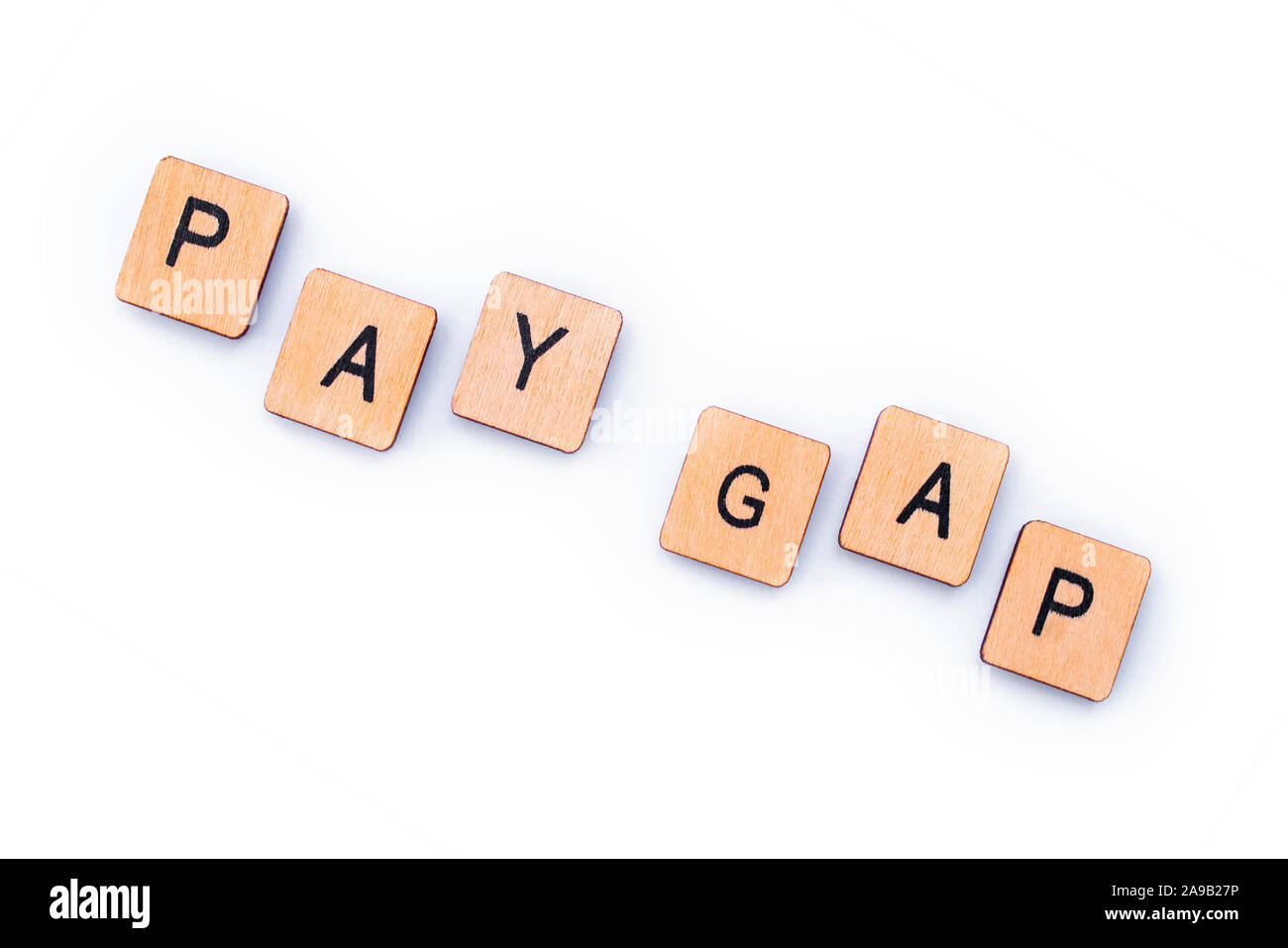 PAY GAP, spelt out with wooden letter tiles Stock Photo - Alamy