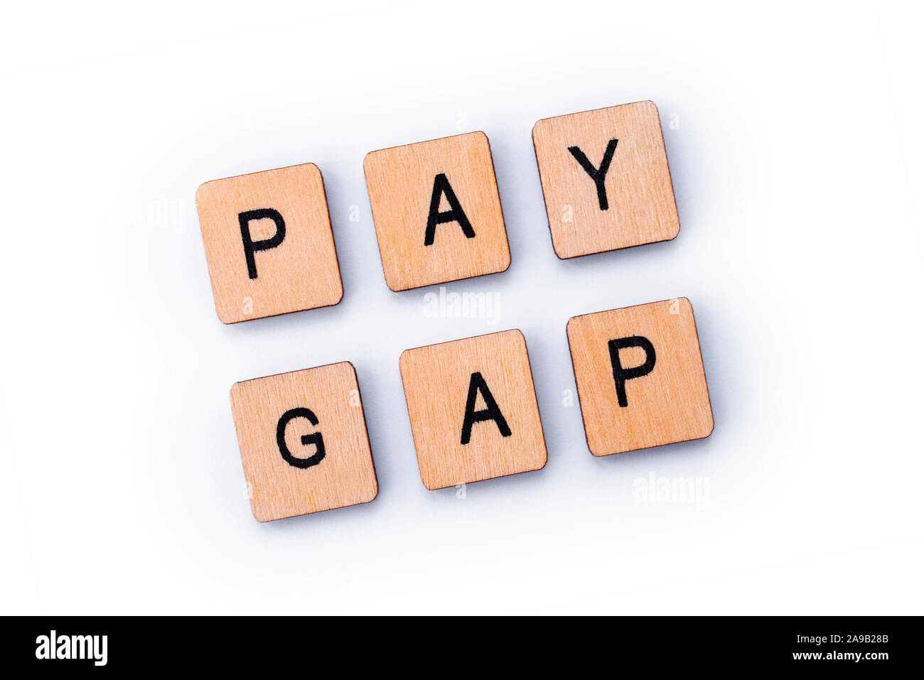 PAY GAP, spelt out with wooden letter tiles Stock Photo - Alamy