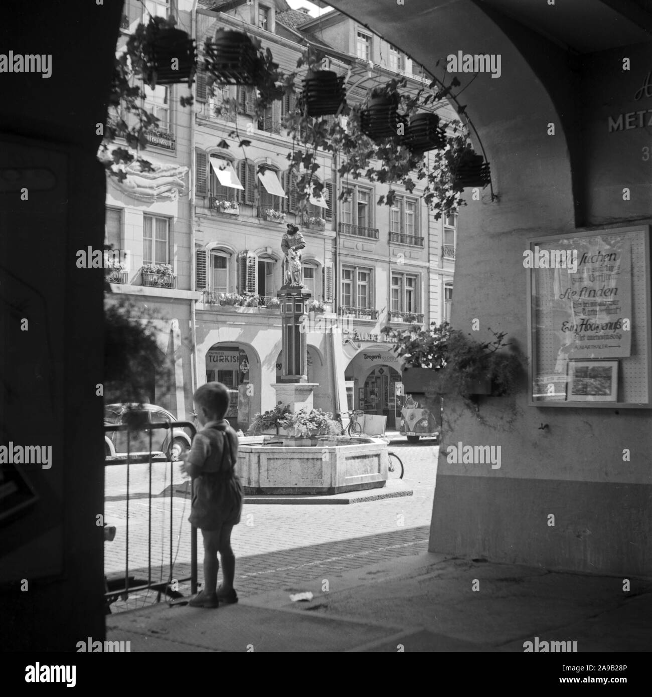 Little shops in the colonnades of Ber, Switzerland 1950s Stock Photo ...