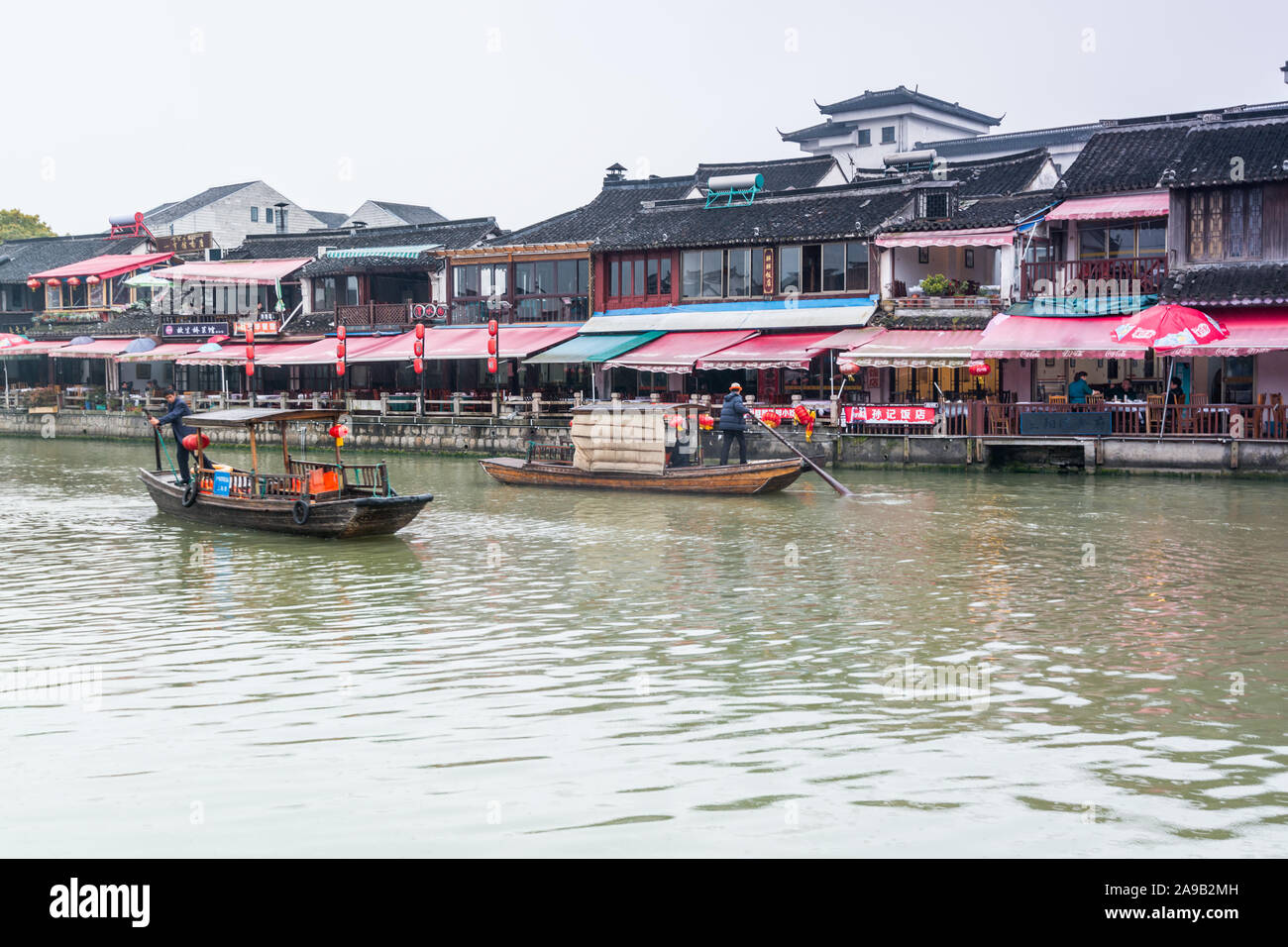 Tourist boats sailing at the canal river in Zhujiajiao, an ancient ...