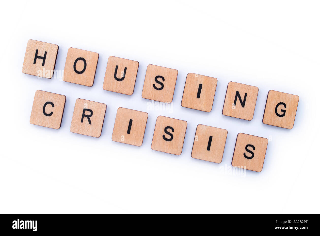 HOUSING CRISIS, spelt with wooden letter tiles Stock Photo - Alamy