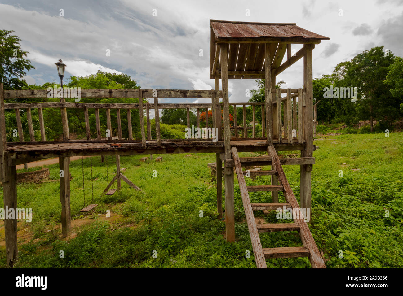 abandoned wooden playground. rusty pieces and decaying wood make this ...