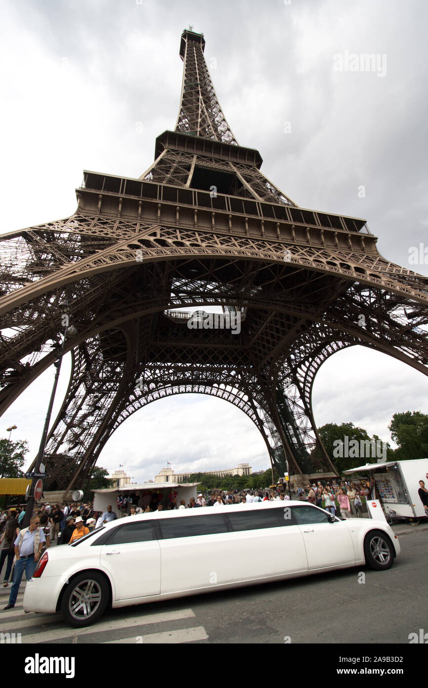 White stretch limo parked below the Eiffel Tower, Paris, France Stock ...