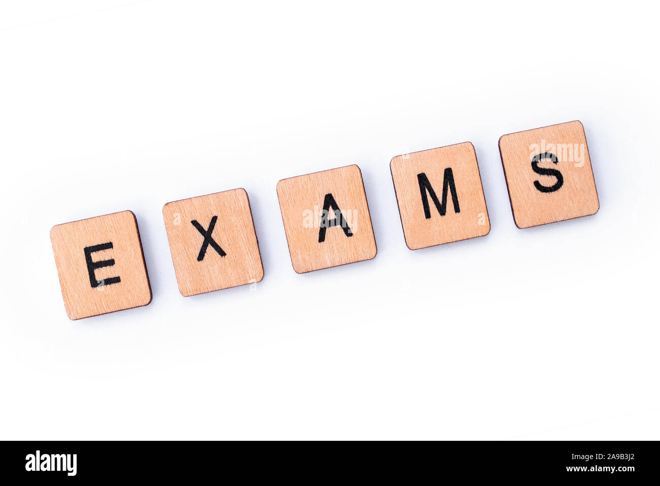 The word EXAMS, spelt with wooden letter tiles Stock Photo - Alamy