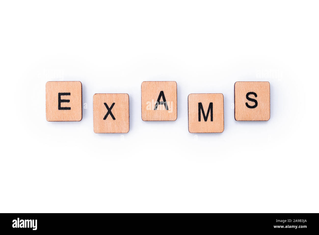 The word EXAMS, spelt with wooden letter tiles Stock Photo - Alamy