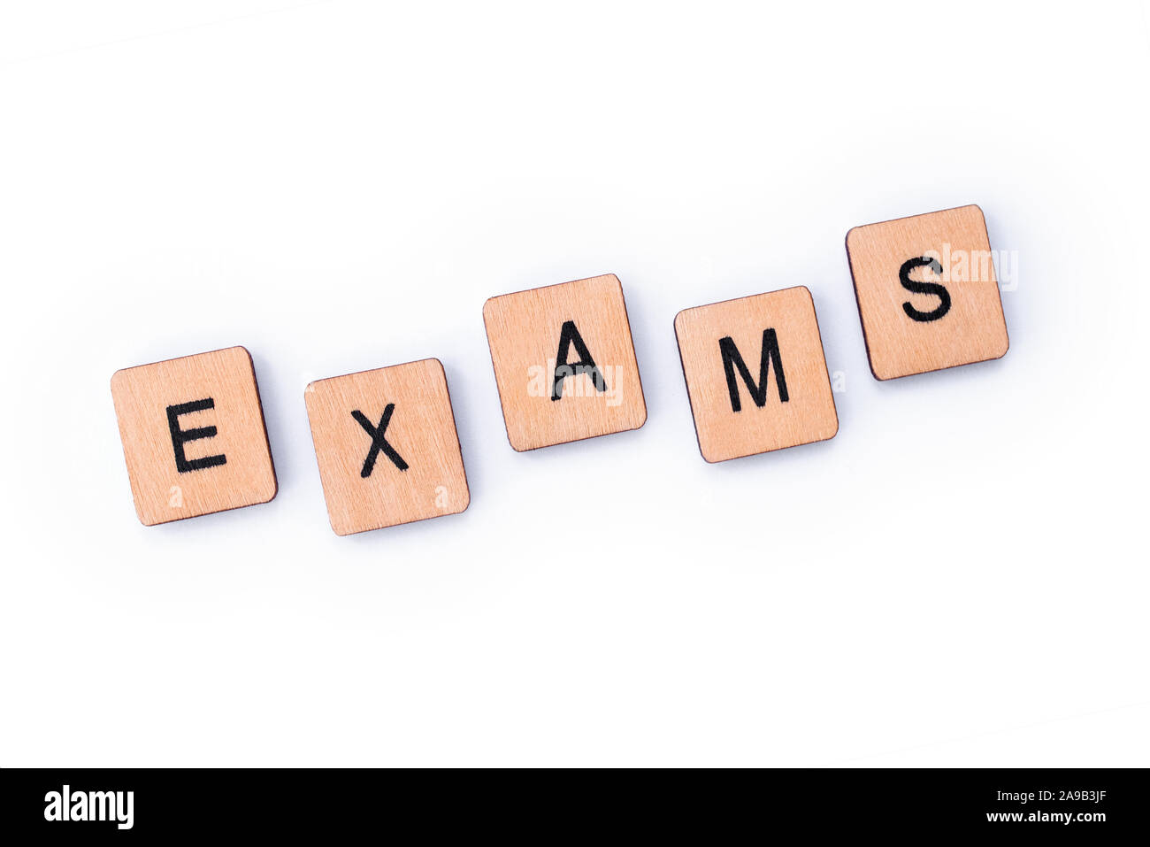 The word EXAMS, spelt with wooden letter tiles Stock Photo - Alamy