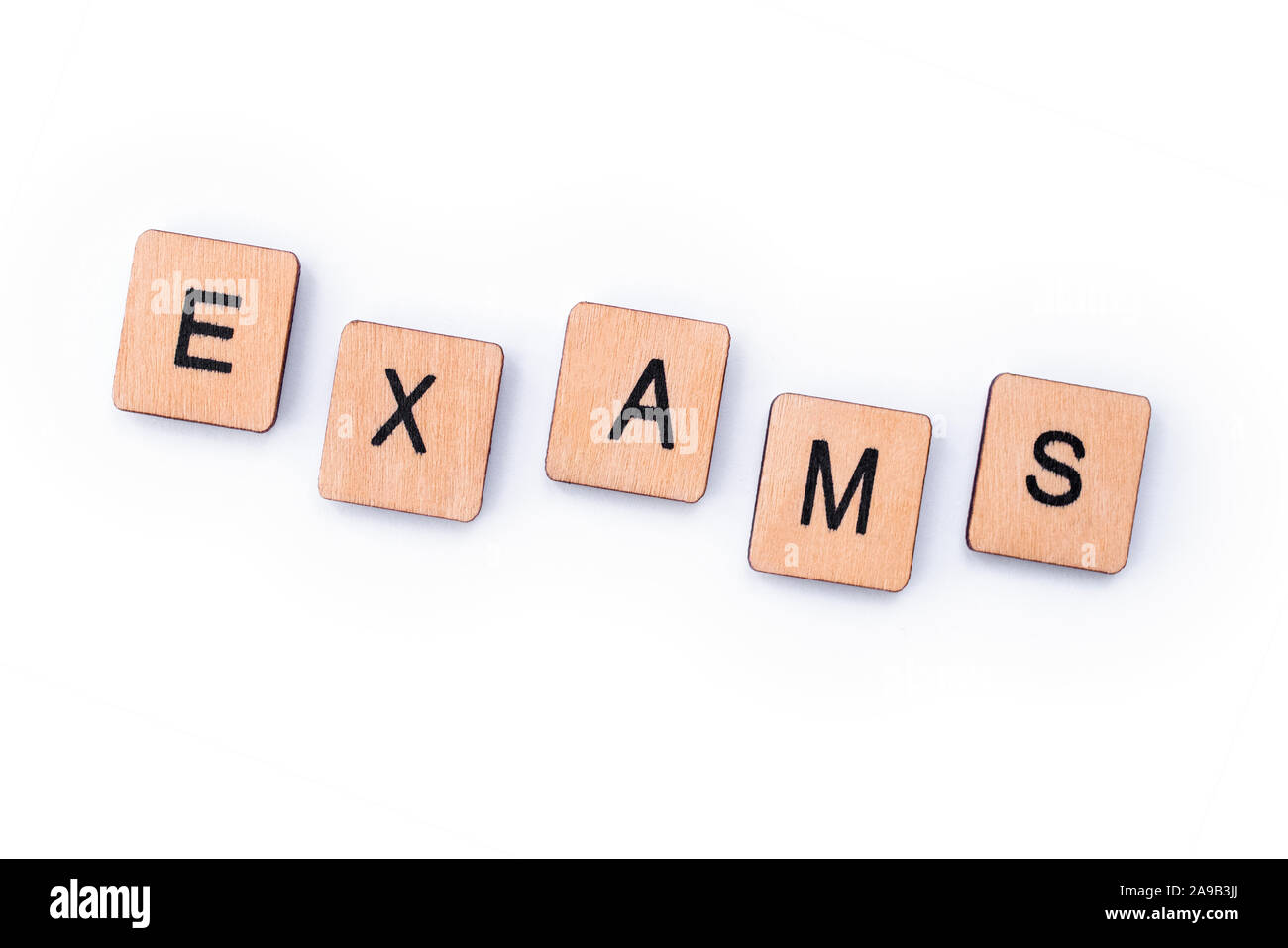 The word EXAMS, spelt with wooden letter tiles Stock Photo - Alamy