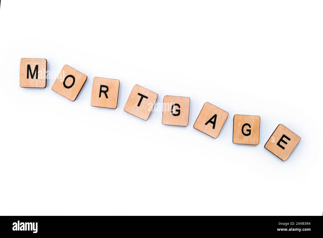 The word MORTGAGE, spelt with wooden letter tiles Stock Photo - Alamy