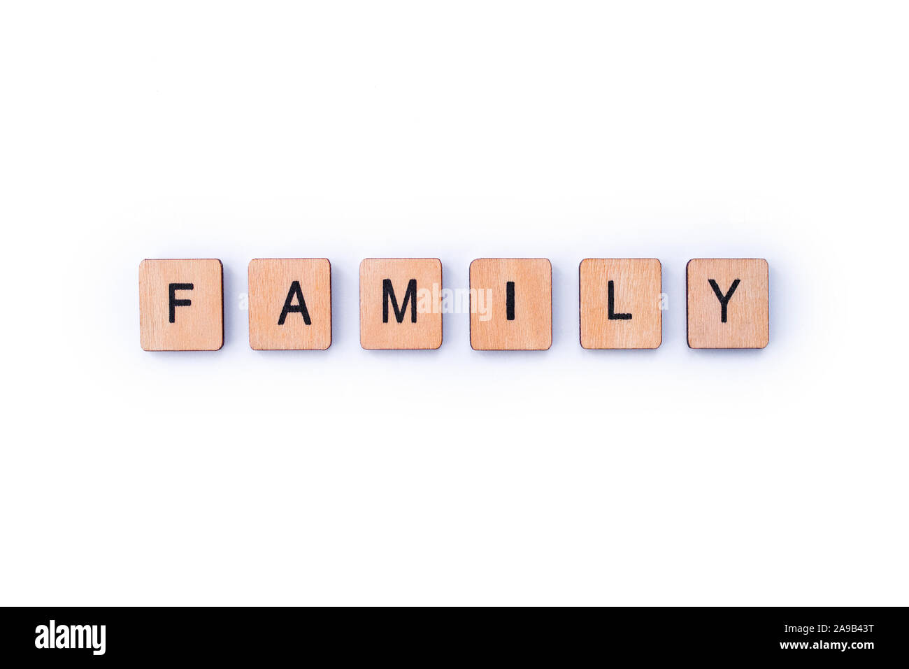 The word FAMILY, spelt with wooden letter tiles Stock Photo - Alamy