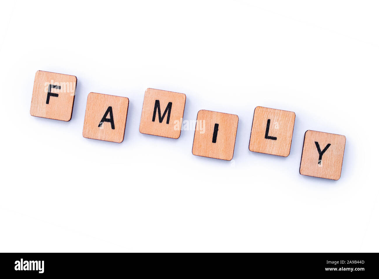 The word FAMILY, spelt with wooden letter tiles Stock Photo - Alamy