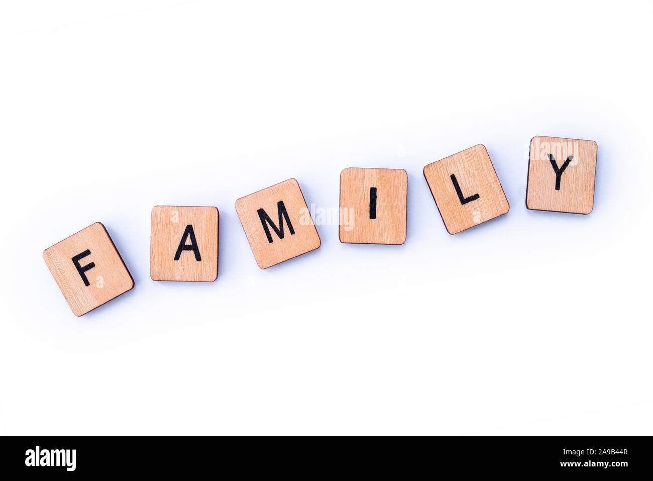 The word FAMILY, spelt with wooden letter tiles Stock Photo - Alamy
