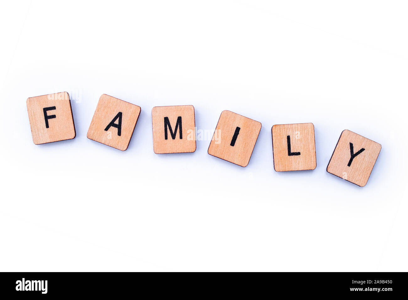The word FAMILY, spelt with wooden letter tiles Stock Photo - Alamy