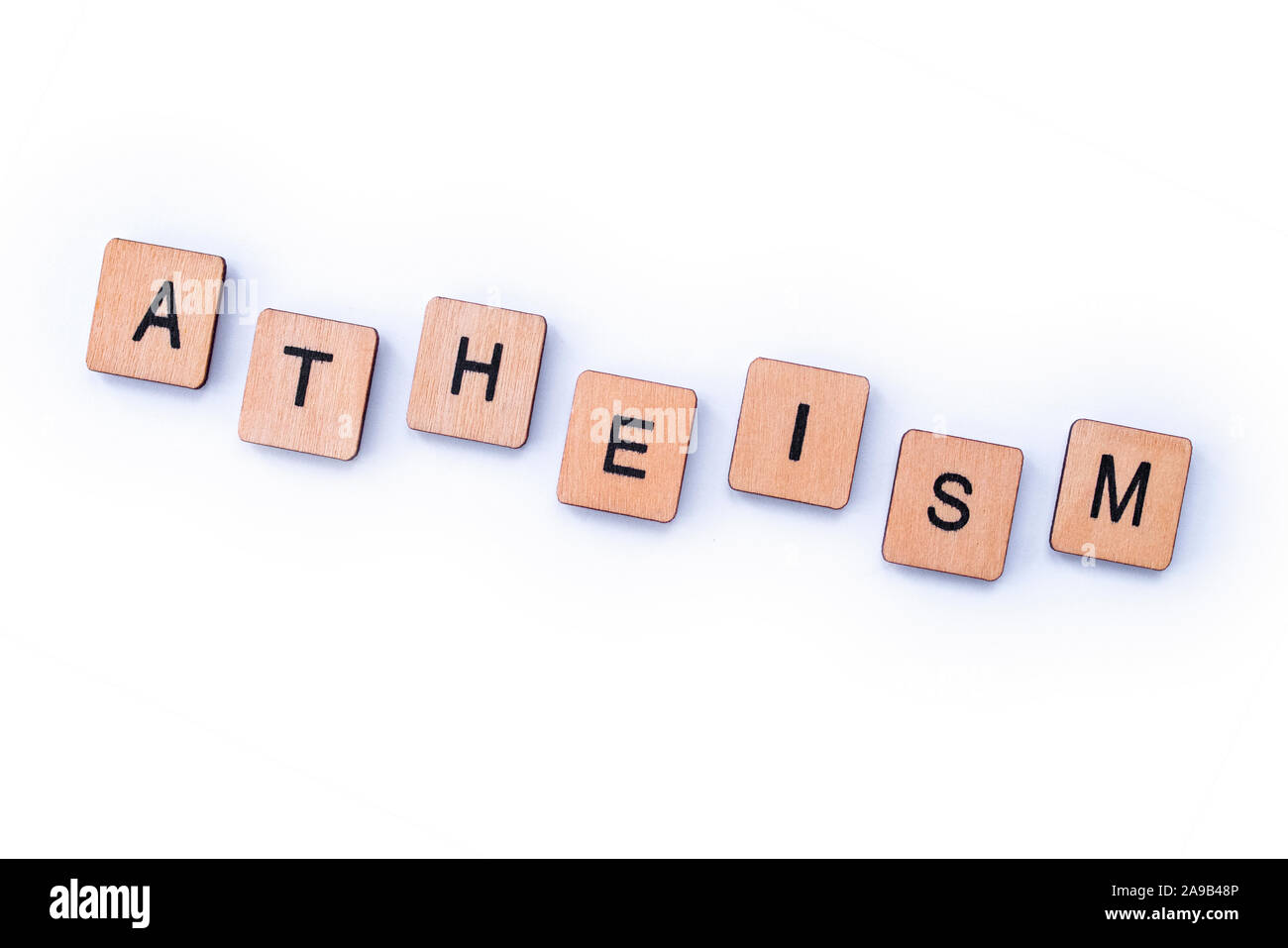 The word ATHEISM, spelt with wooden letter tiles Stock Photo - Alamy