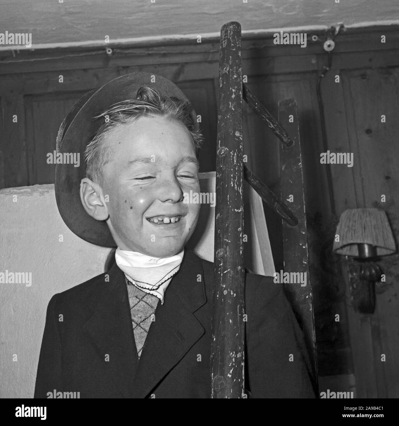 A little boy playing the chimney sweeper as a symbol for luck for the ...